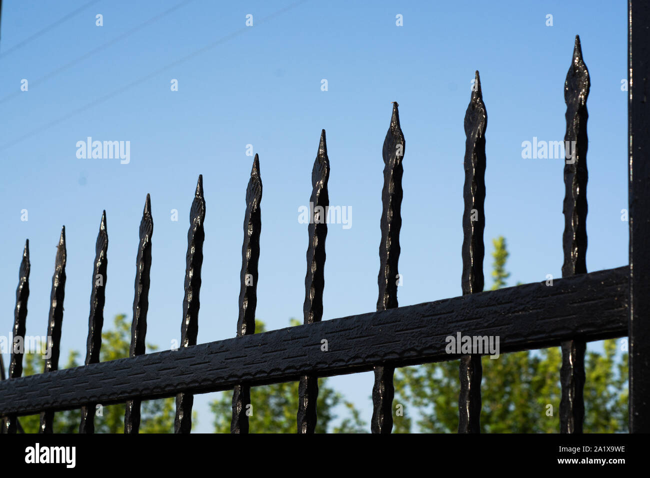 Wire fence on sky background Stock Photo - Alamy