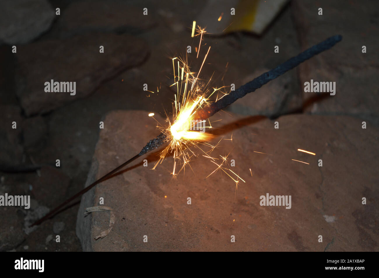 Indian lady playing with fire cracker with rose and candle on indian ...