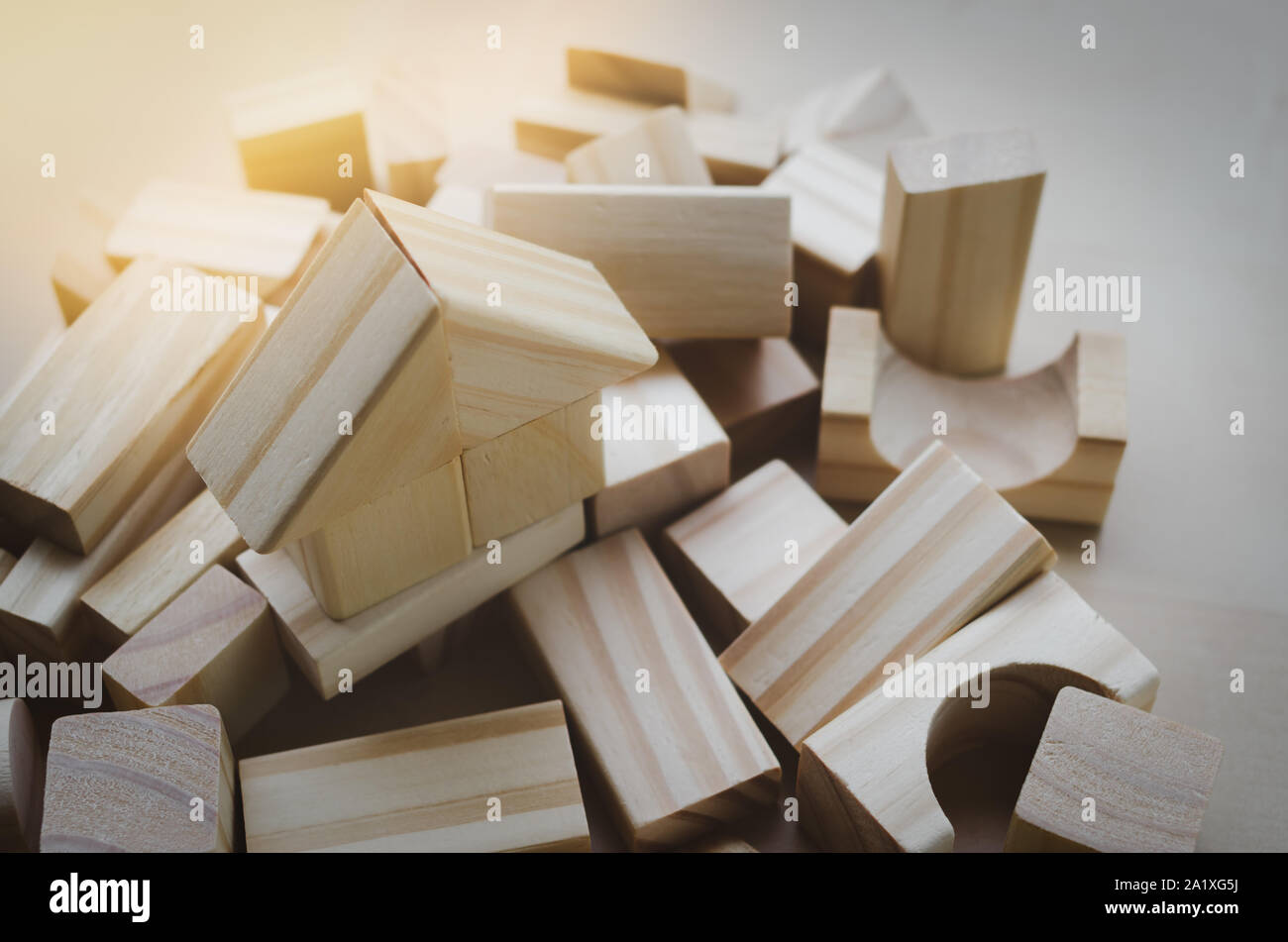 house from natural color wooden block on the stack of wooden blocks ...