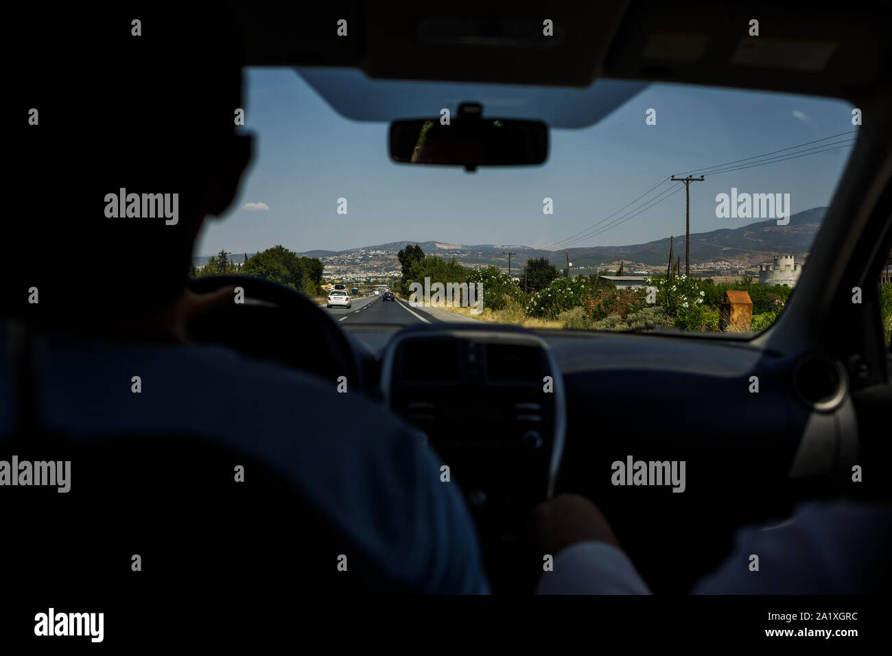 inside view of the car on the road in summer. Man drives a car Stock ...