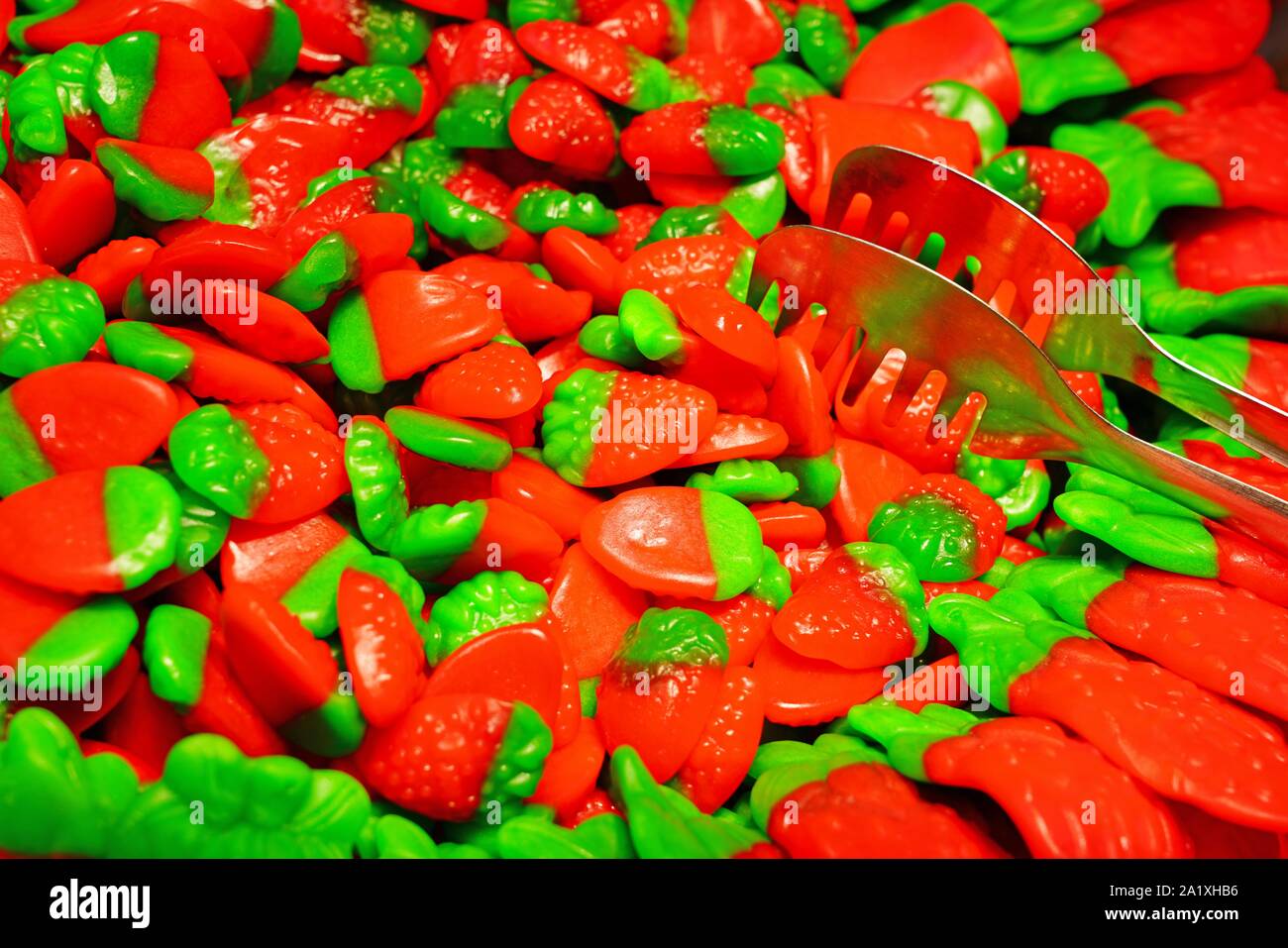Red and green strawberry gummy candy Stock Photo - Alamy