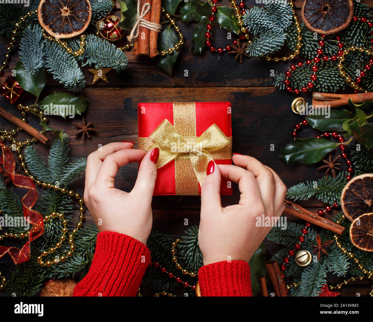 Christmas composition with hands keeping gift box top view Stock Photo ...