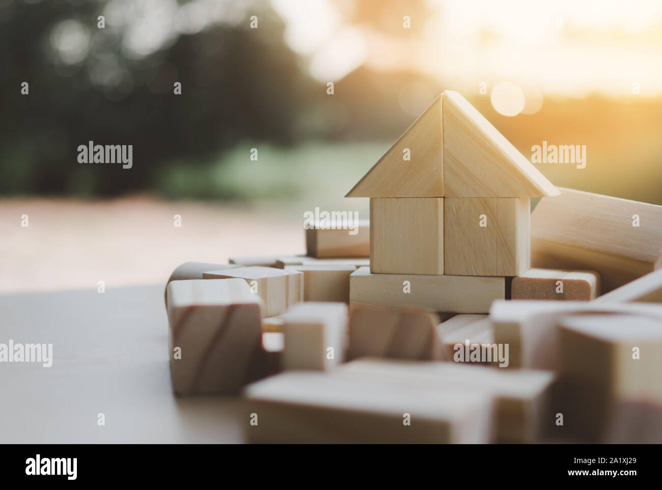 house from natural color wooden block on the stack of wooden blocks ...