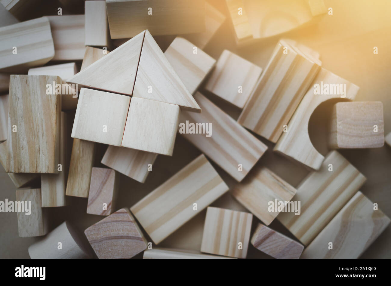 house from natural color wooden block on the stack of wooden blocks ...