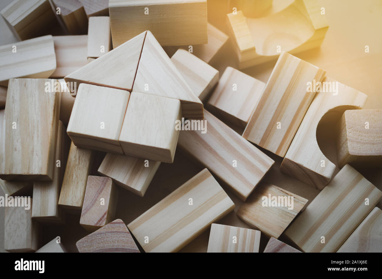 house from natural color wooden block on the stack of wooden blocks ...