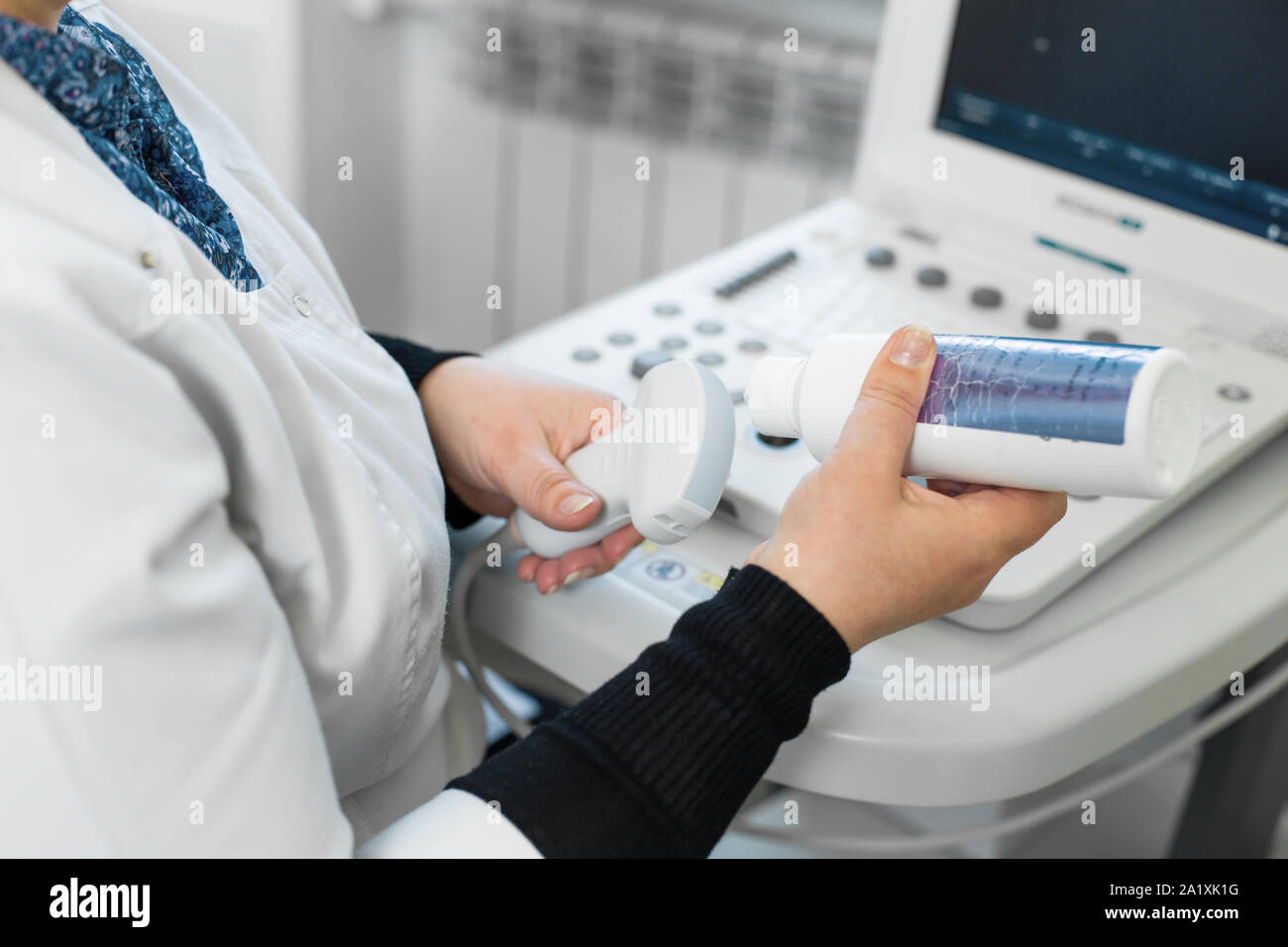 Doctor prepare an ultrasound machine for the diagnosis of a patient ...