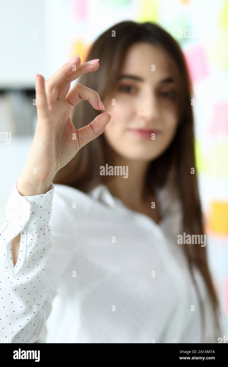 Ok sign in modern office Stock Photo - Alamy