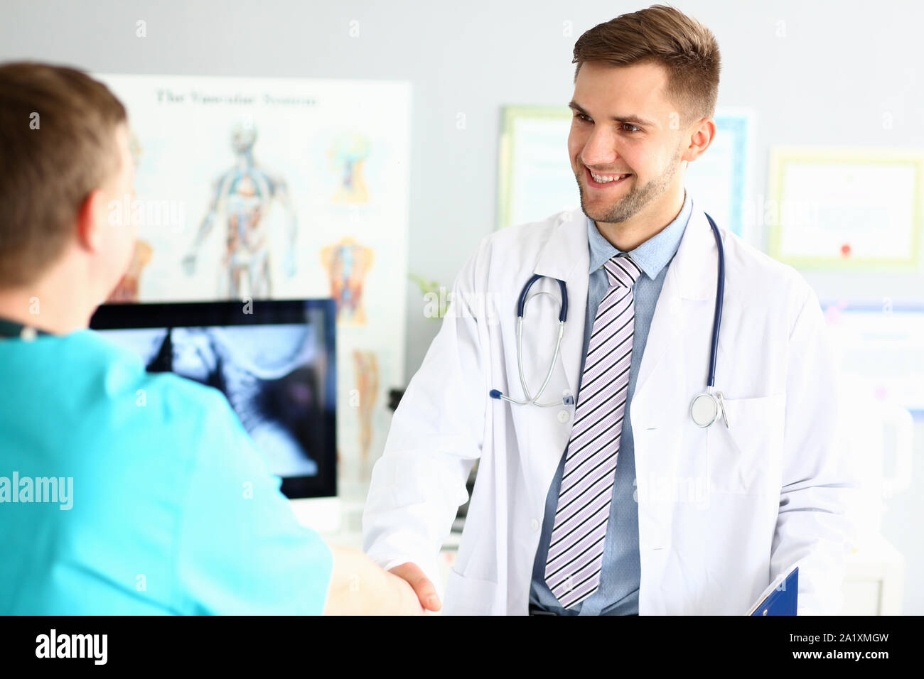 Smart doctor smiling Stock Photo - Alamy