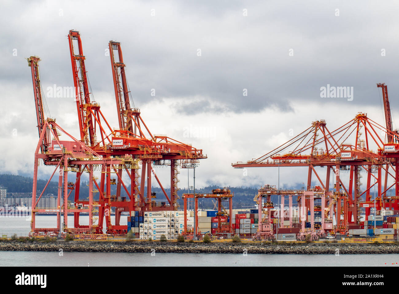 Cargo shipping dock with cranes and shipping containers Stock Photo - Alamy