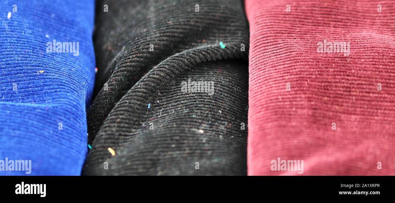 Colorful detailed fabric textures of different cloth types in a close ...