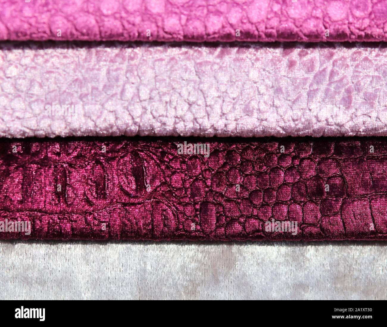 Colorful detailed fabric textures of different cloth types in a close ...