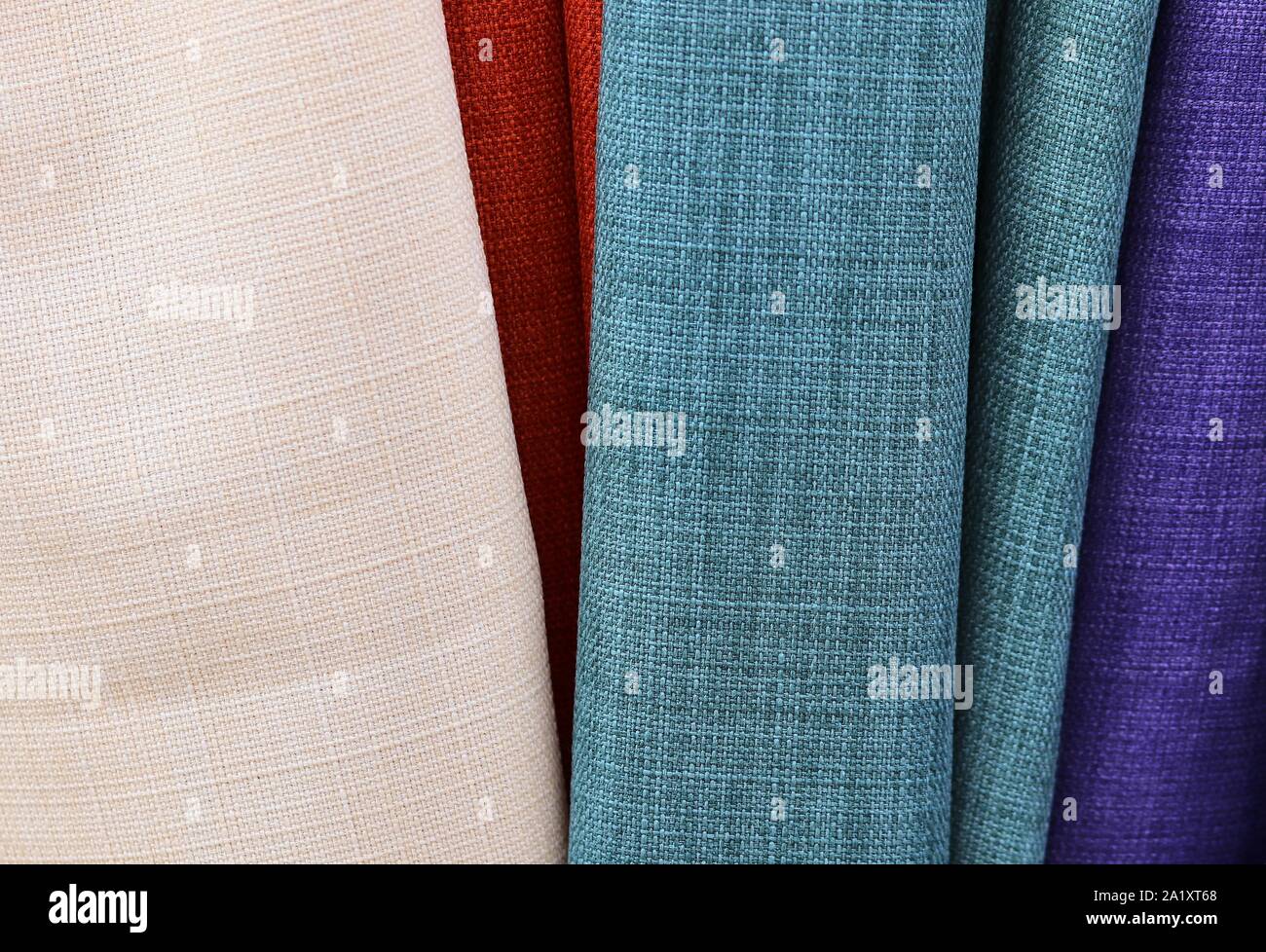 Colorful detailed fabric textures of different cloth types in a close ...