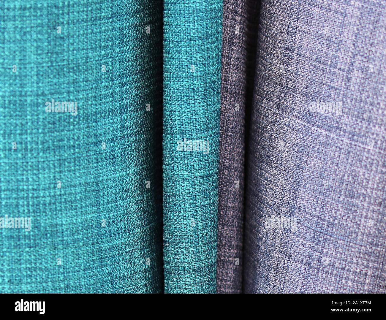 Colorful detailed fabric textures of different cloth types in a close ...