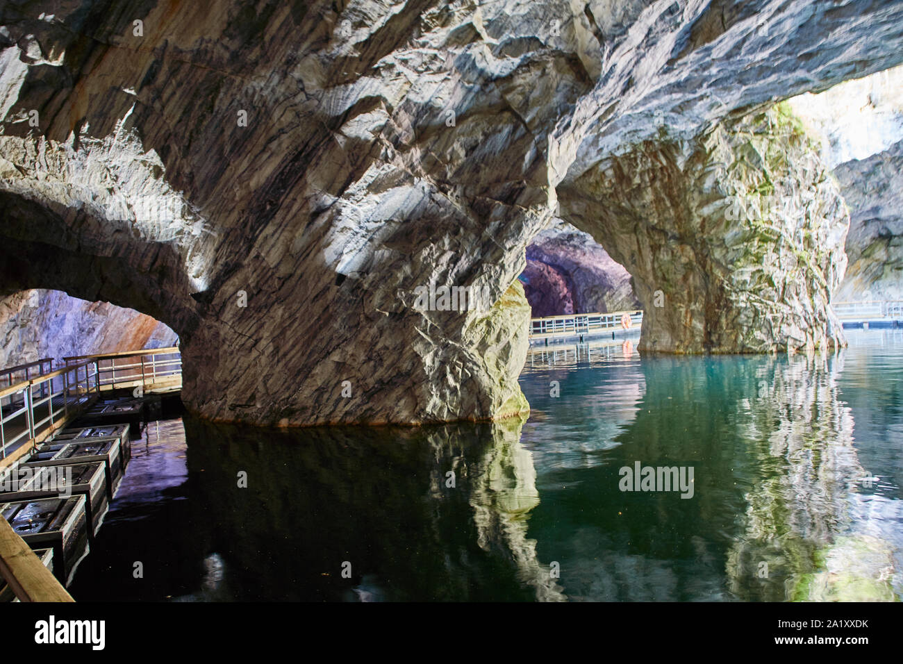 Types of a former underground marble quarry flooded with water. The ...