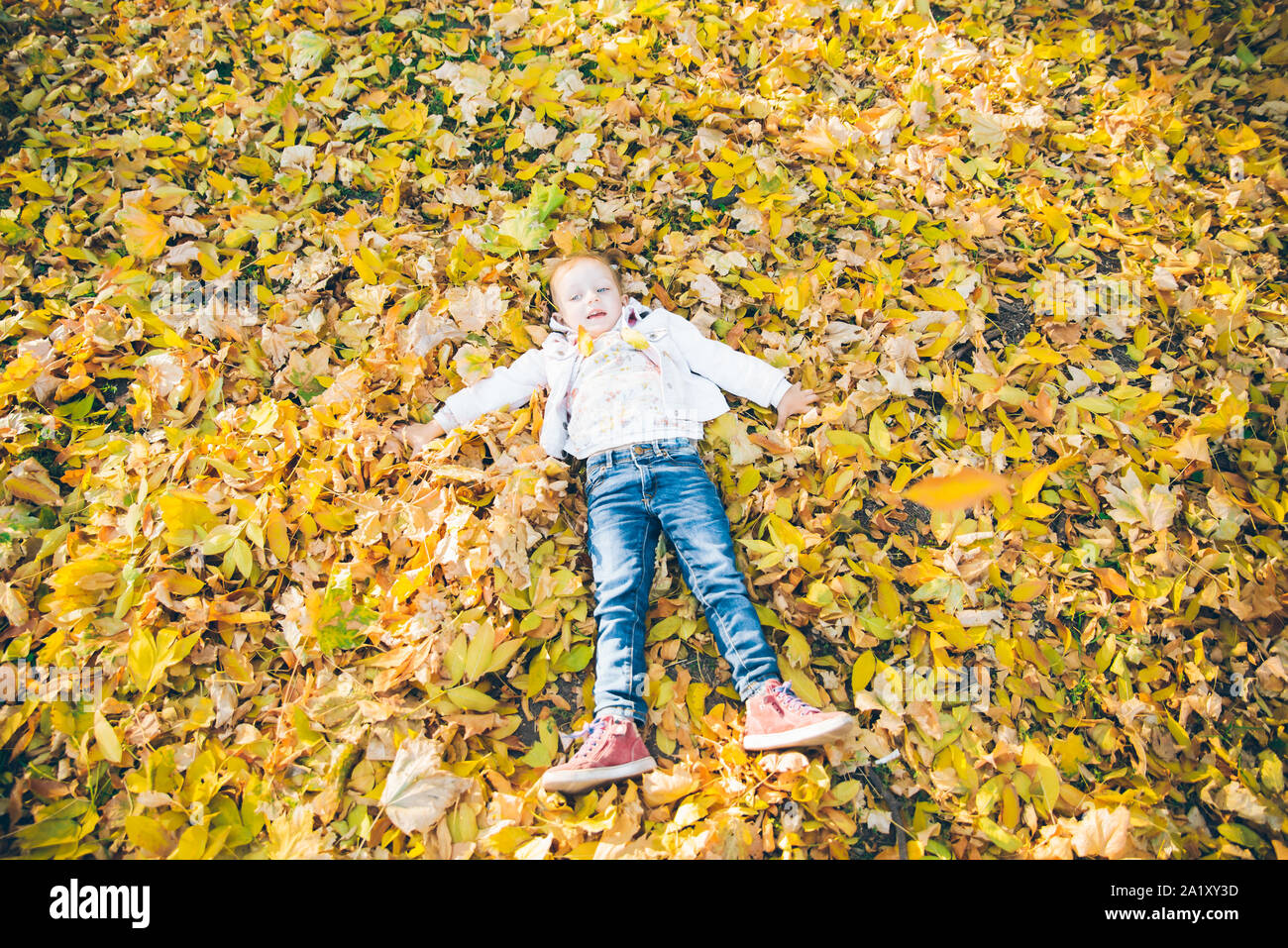 Girl laying on the ground hi-res stock photography and images - Alamy