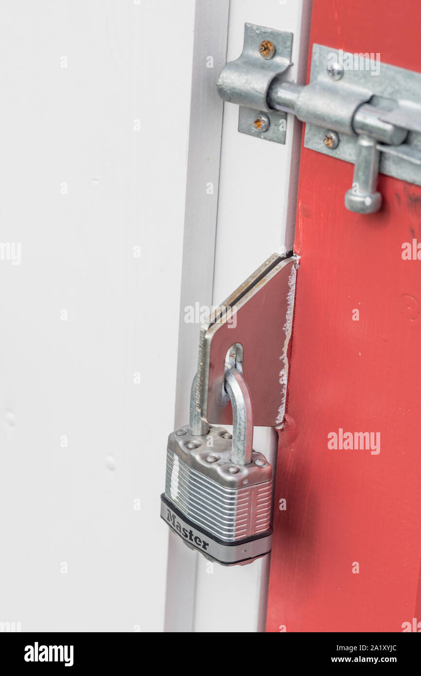Close shot padlocked beach hut door @ Par Beach, Cornwall. Locked in ...