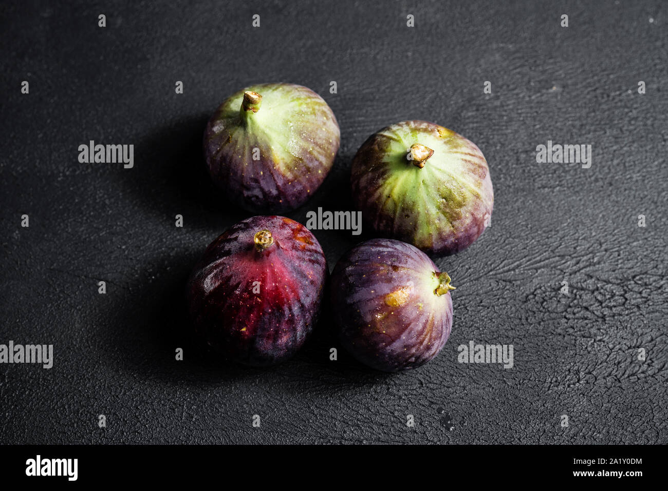 fresh figs close-up photo on black background. dark moody photo Stock ...