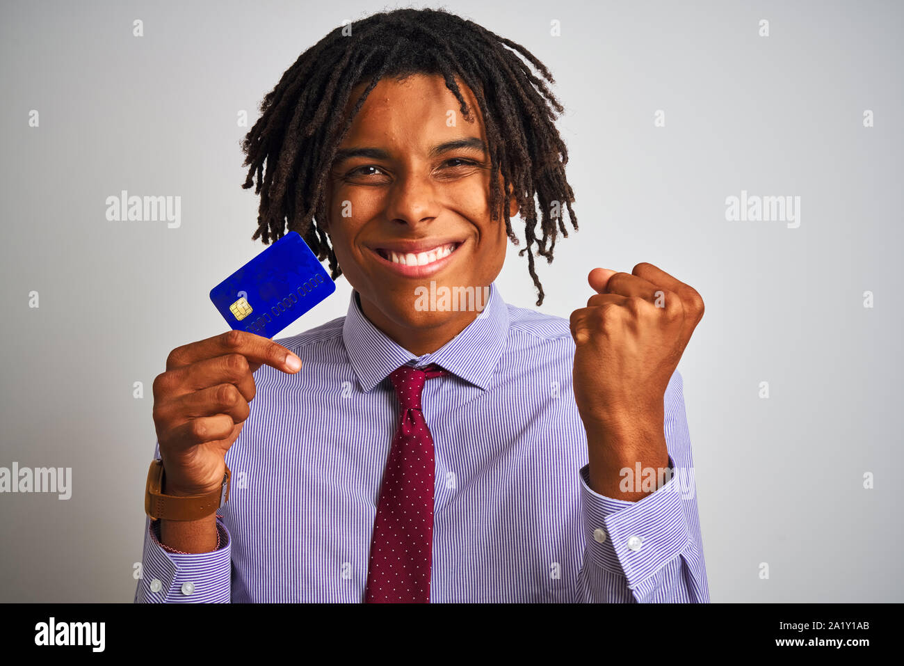 Afro american businessman with dreadlocks holding credit card over ...