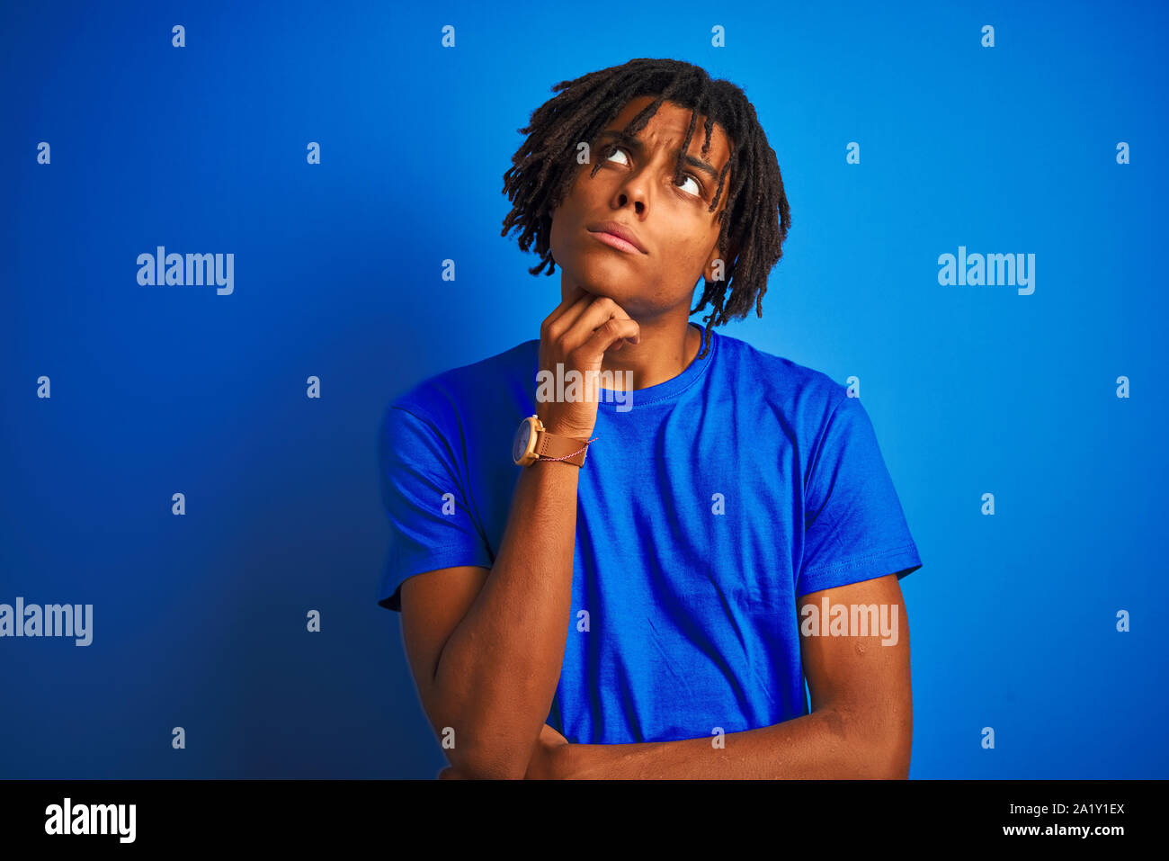 Afro american man with dreadlocks wearing t-shirt standing over ...