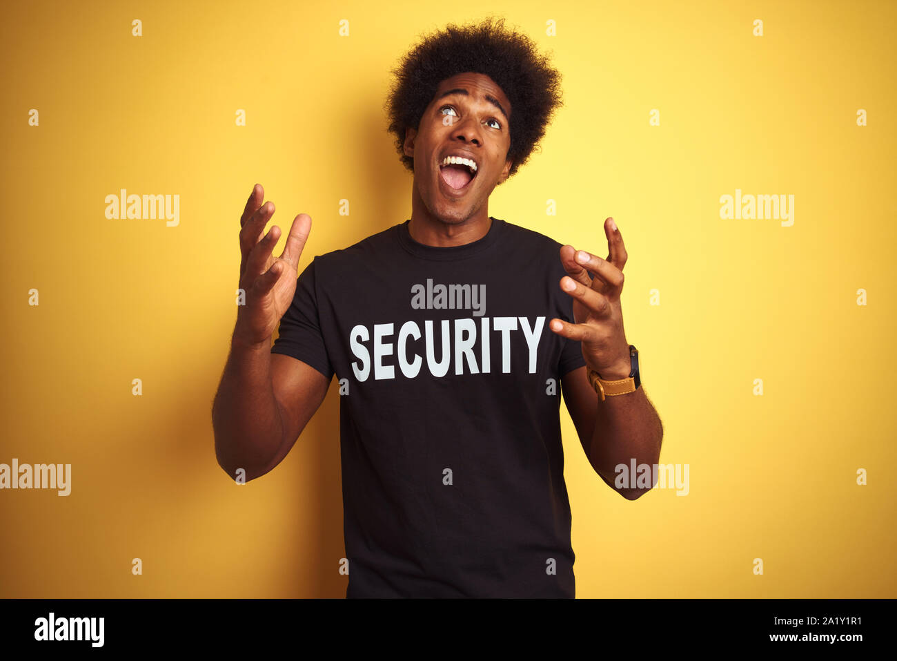 American safeguard man with afro hair wearing security uniform over ...