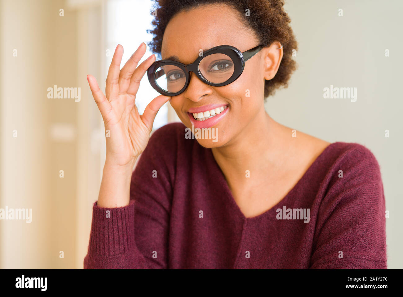 Beautiful young african woman with afro hair wearing glasses Stock ...