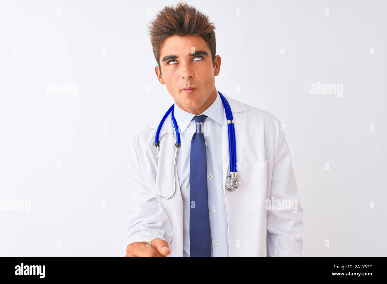 Young handsome doctor man wearing stethoscope over isolated white ...