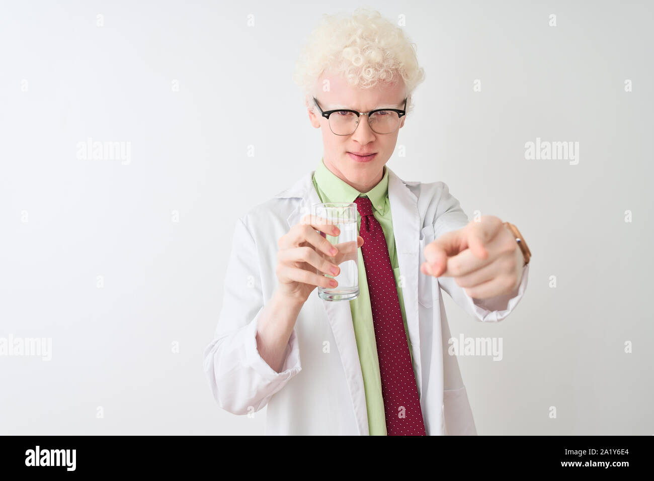 Albino scientist man wearing glasses holding glass of water over ...