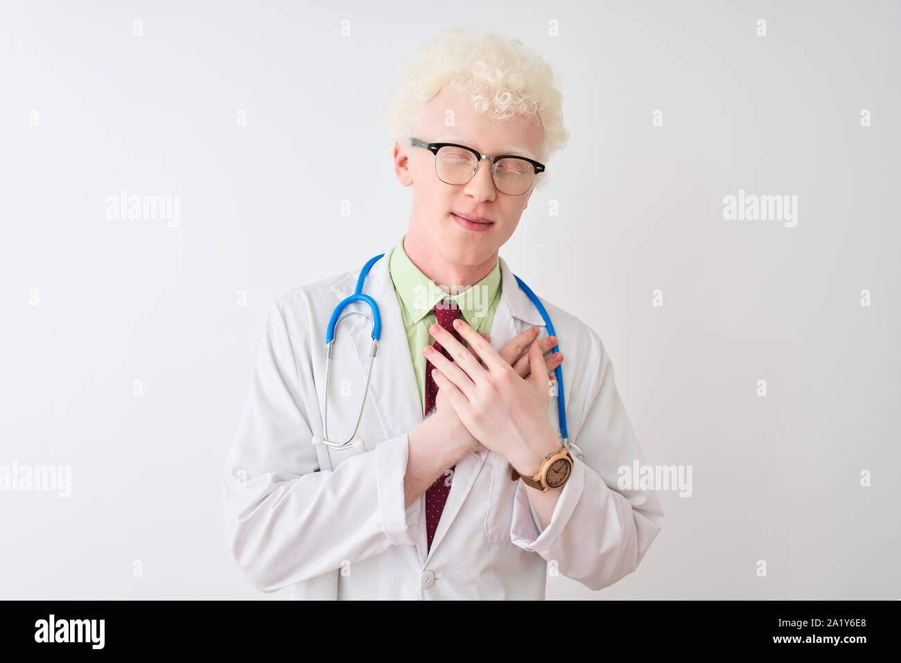 Young albino doctor man wearing stethoscope standing over isolated ...
