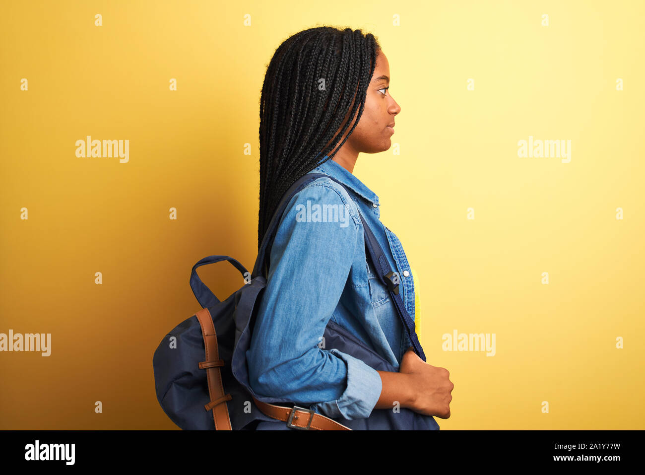 African american student woman wearing backpack standing over isolated ...