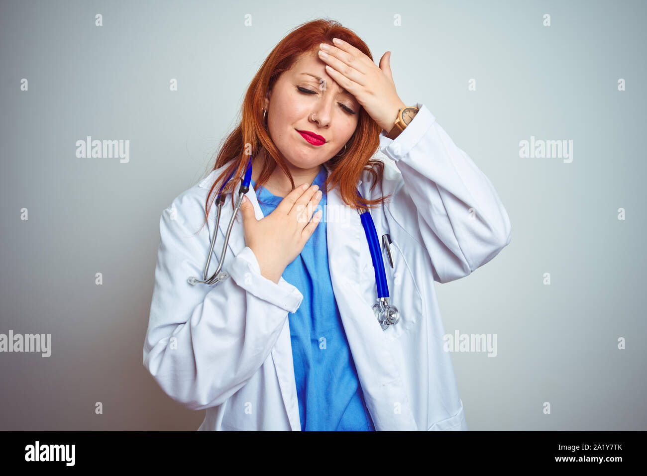 Young redhead doctor woman using stethoscope over white isolated ...