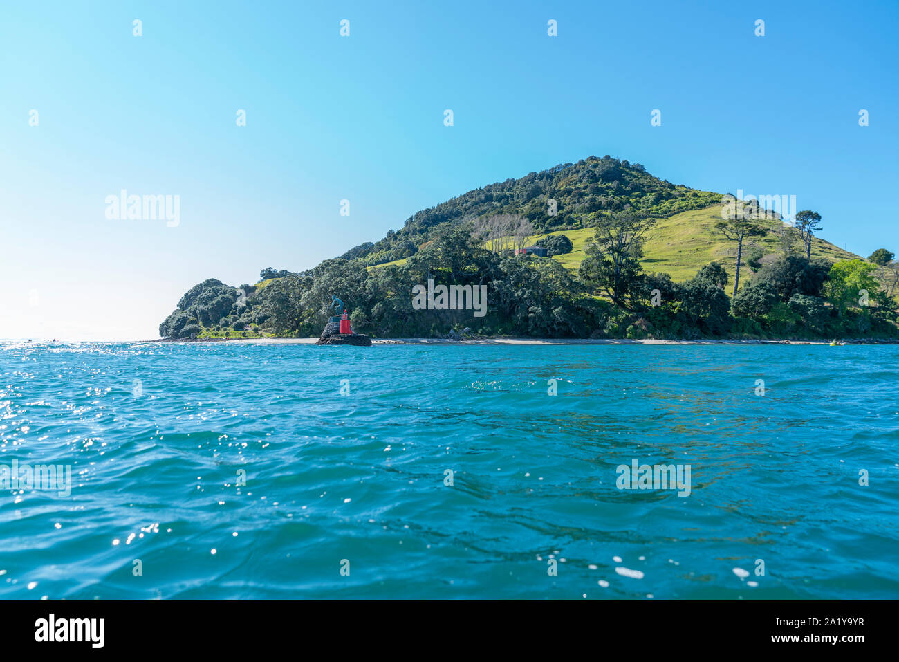 Base of landmark Mount Maunganui with Maori warrior statue from water ...
