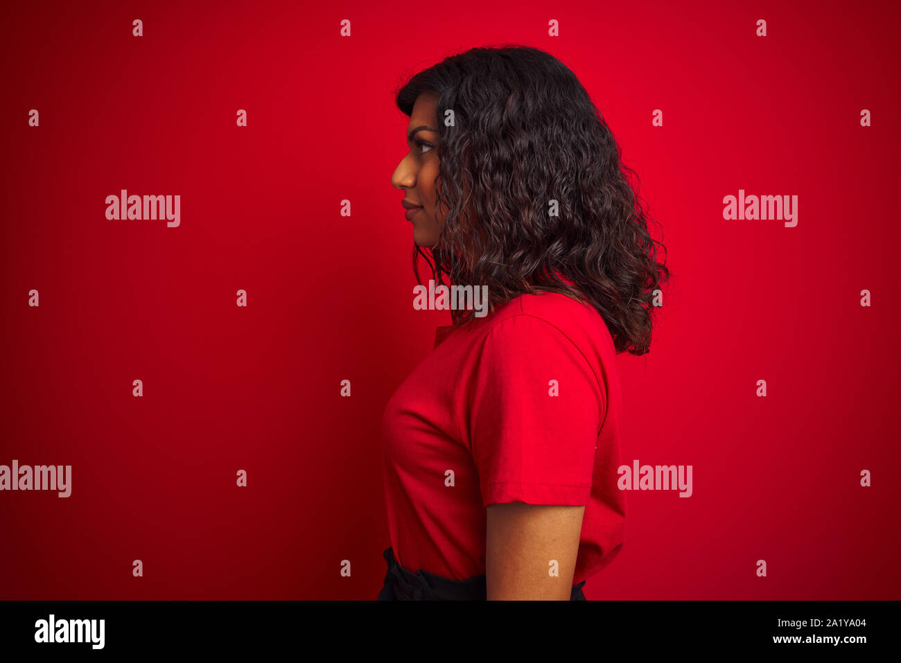 Beautiful transsexual transgender woman wearing t-shirt over isolated ...