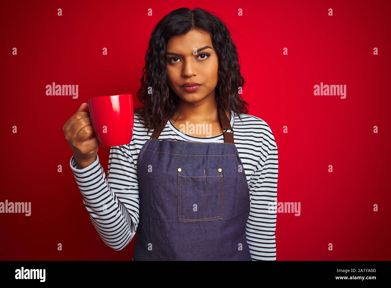 Transsexual transgender barista woman holding cup of coffee over ...