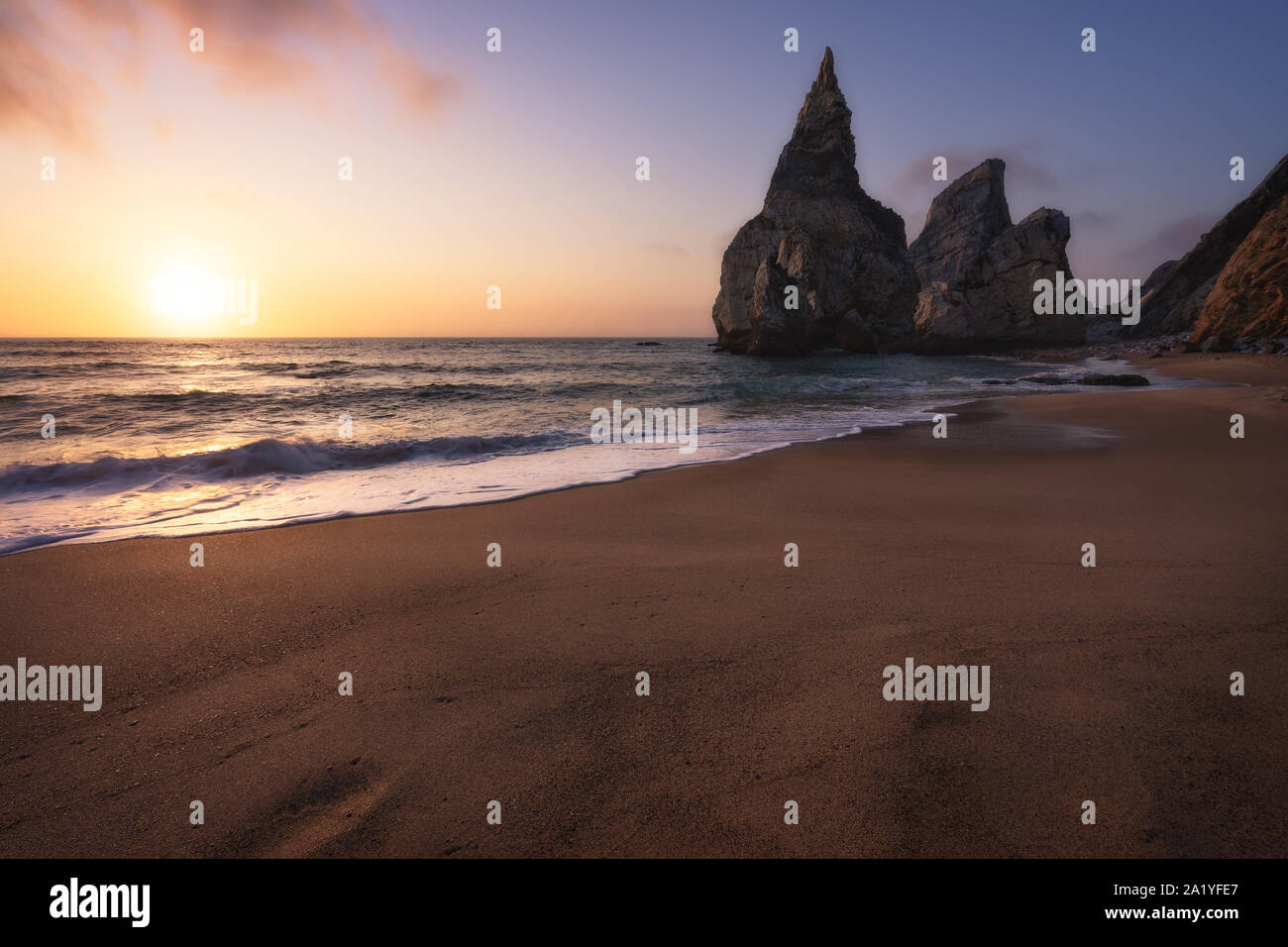 Ursa Beach, Sintra, Portugal. Sand beach with rocks silhouette in ...