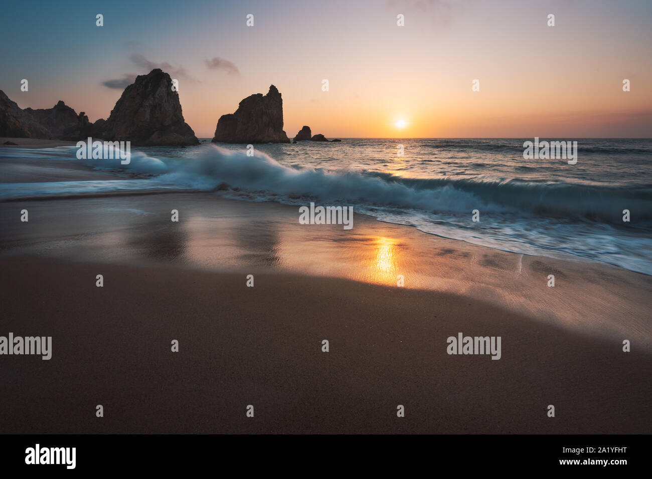 Portugal Ursa Beach at atlantic coast. Sunset reflection. White wave ...