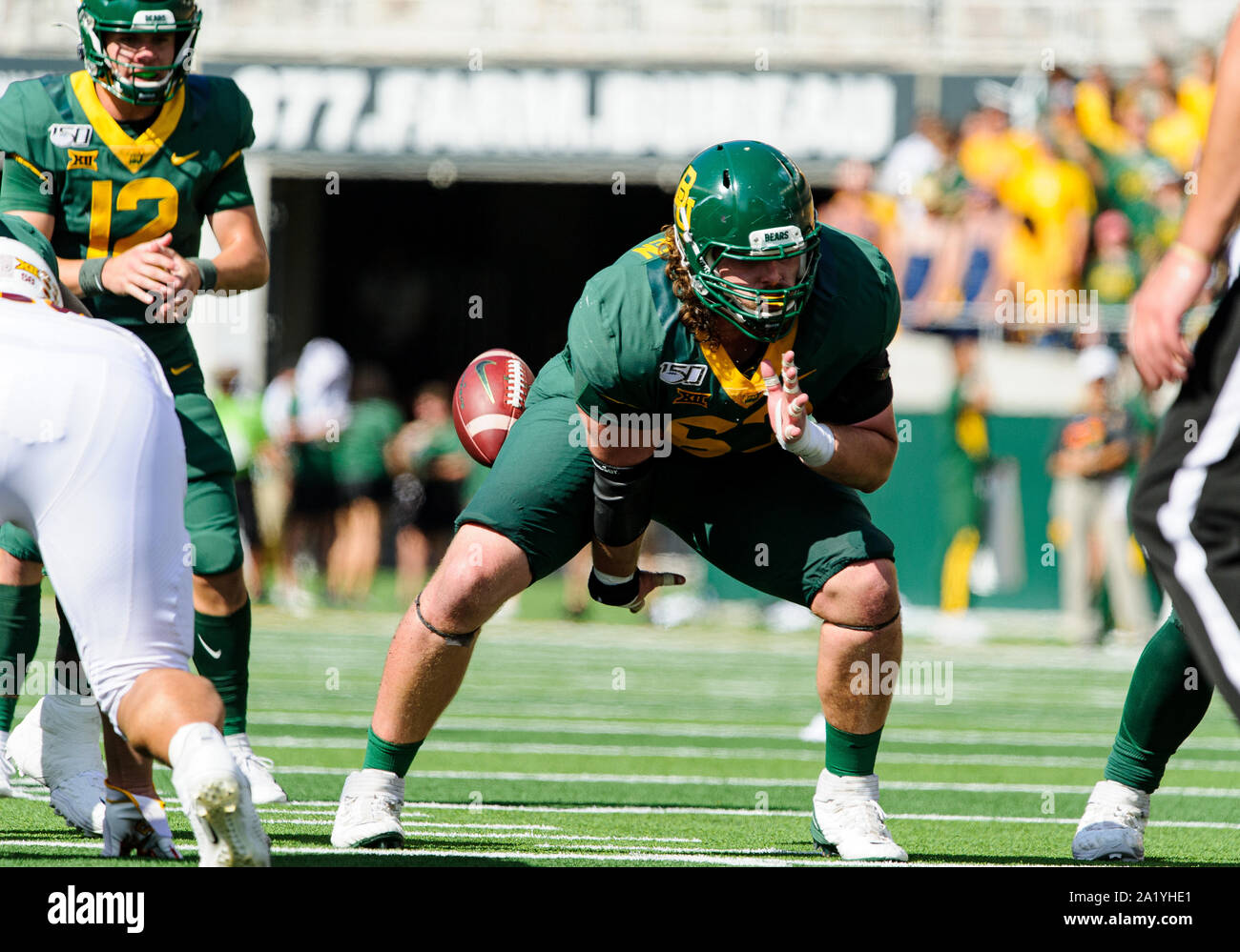 Waco, Texas, USA. 28th Sep, 2019. Baylor Bears offensive lineman Jake Fruhmorgen (63) snaps the ...