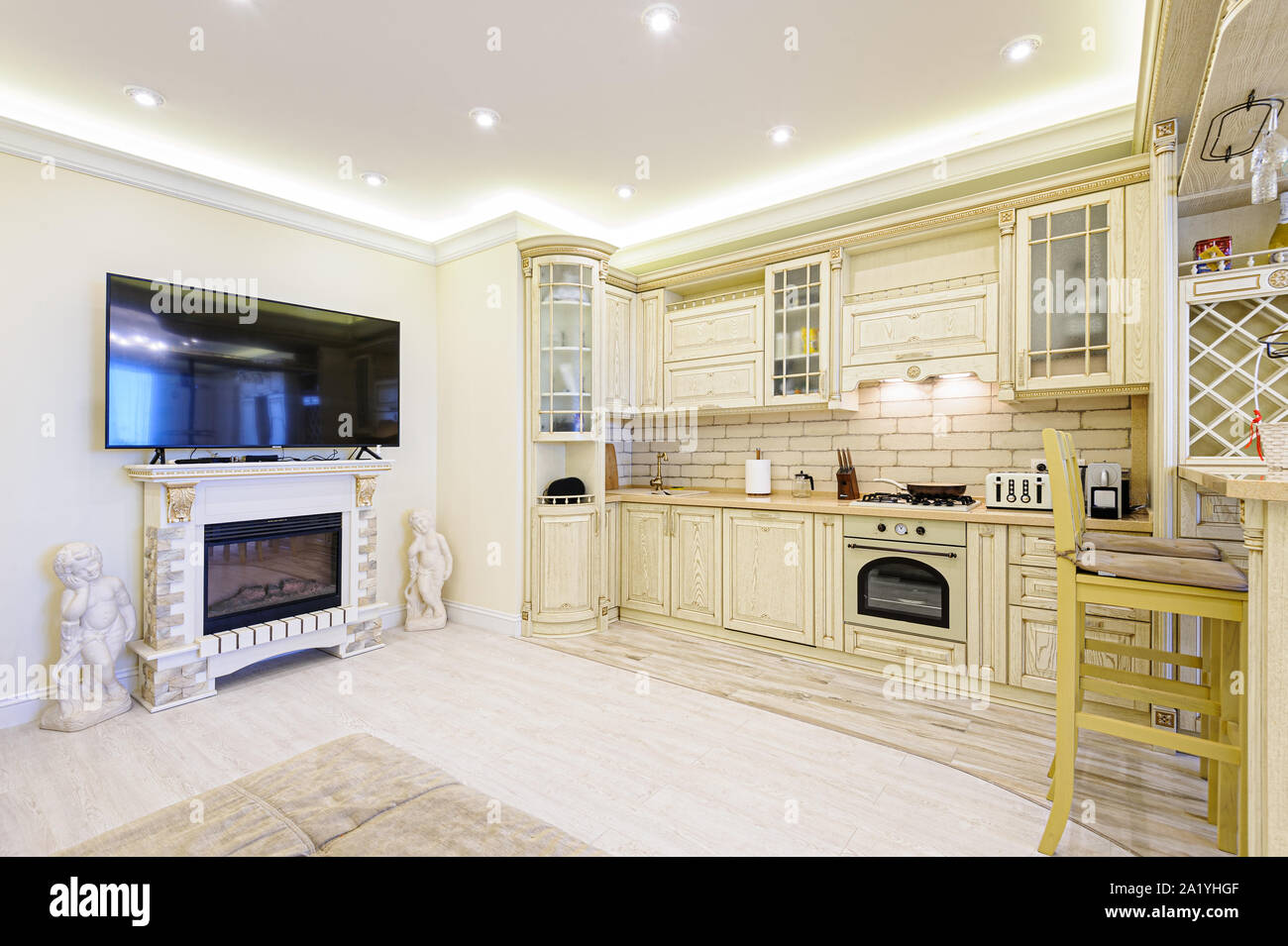 Luxury modern beige kitchen interior Stock Photo - Alamy