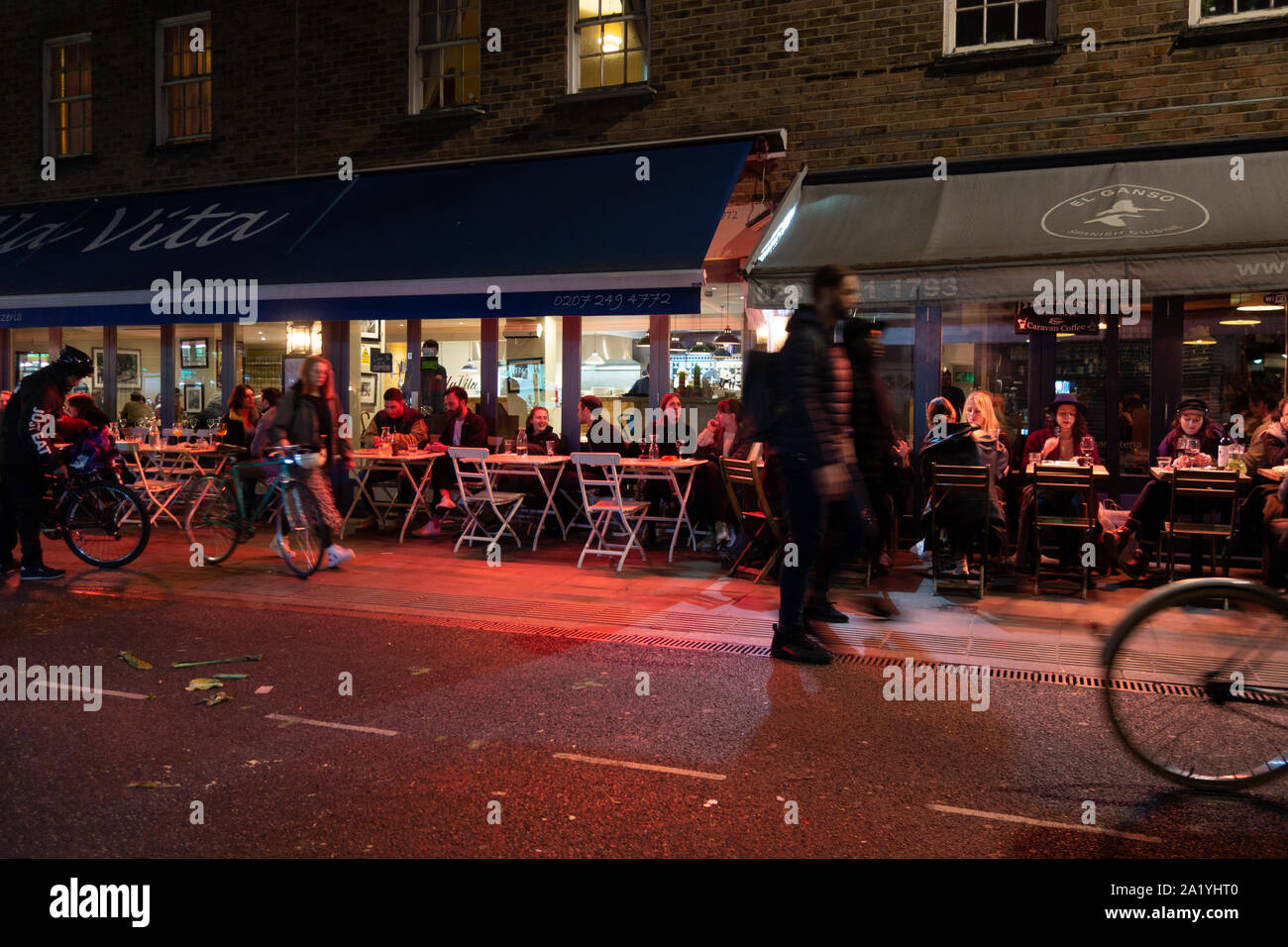 night scene of restaurants in Broadway Market, London Stock Photo - Alamy