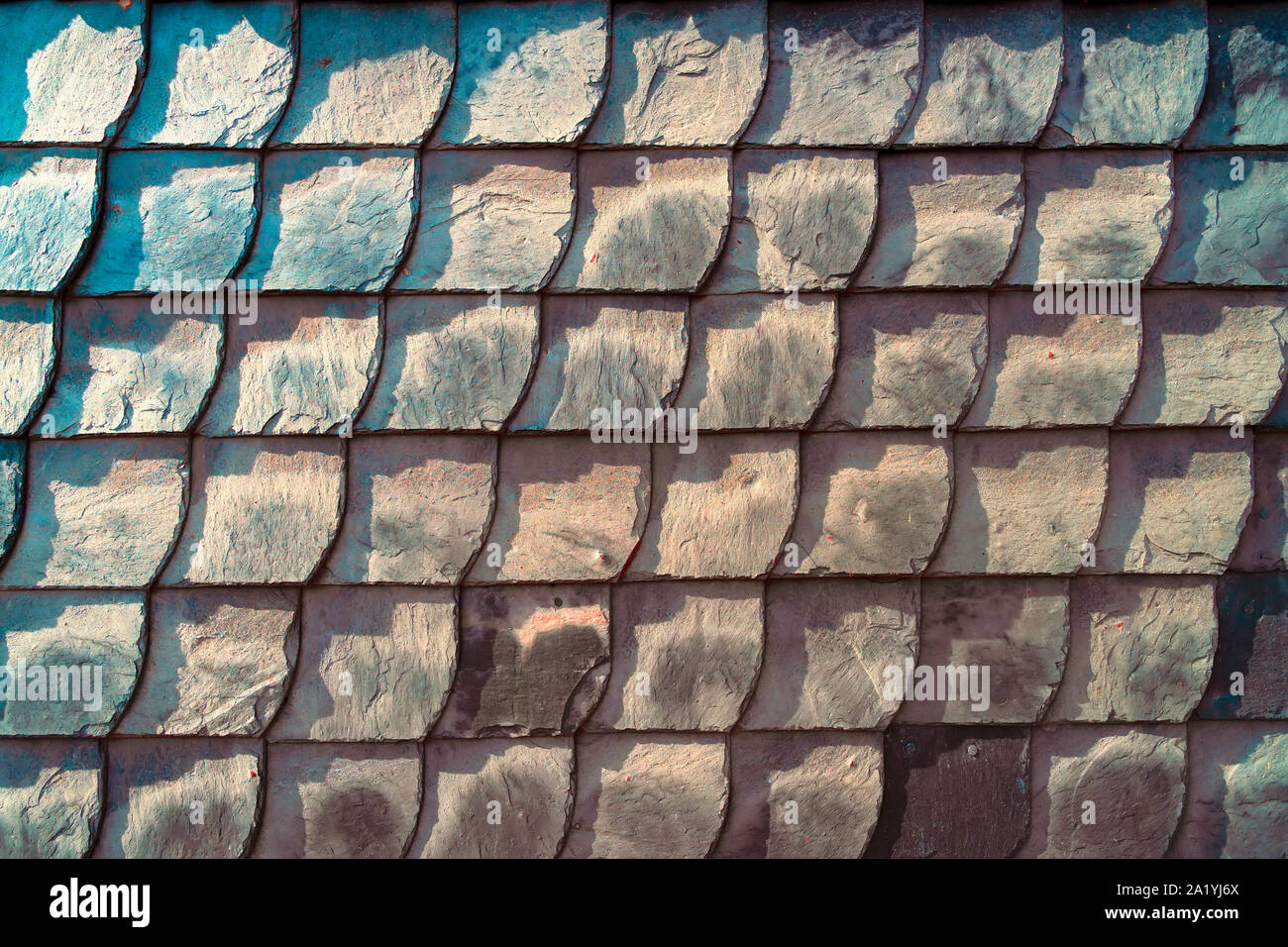 Texture of the colored layered wall, similar to a decorative tile ...