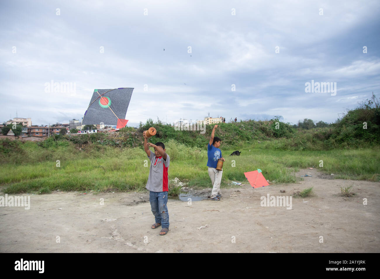 Kathmandu, Nepal. 29th Sep, 2019. Two nepali kid trying to fly their ...