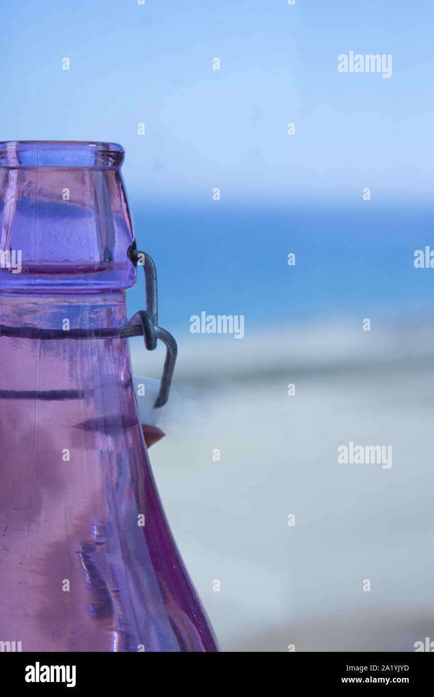 Classic transparent glass bottle with color Stock Photo - Alamy