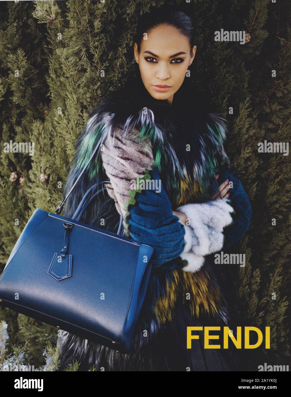 poster advertising FENDI fashion house with Joan Smalls in paper ...