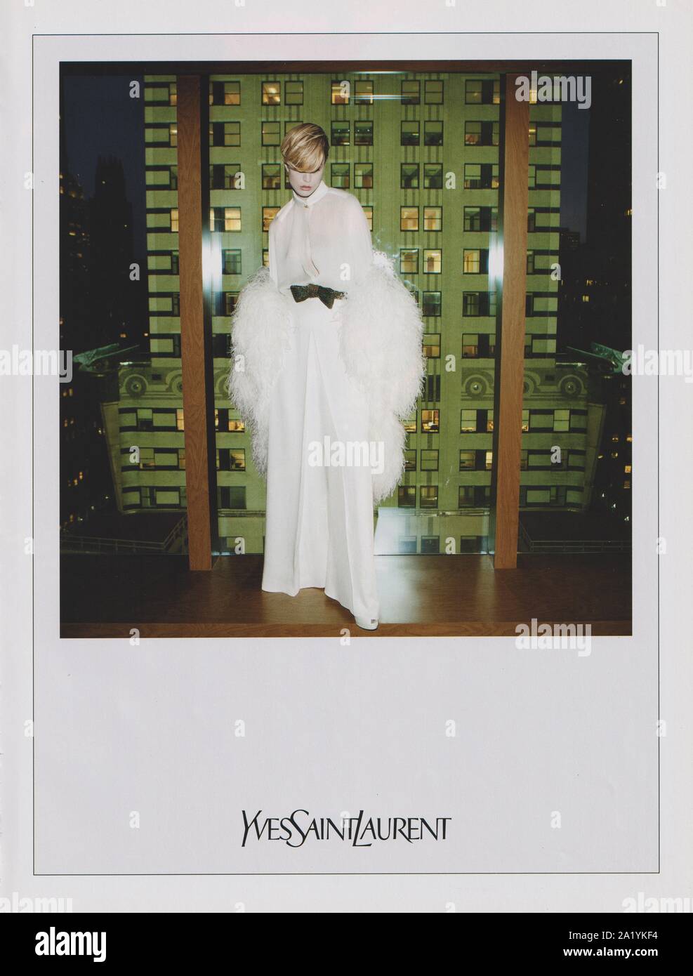 poster advertising Yves Saint Laurent fashion house in paper magazine ...