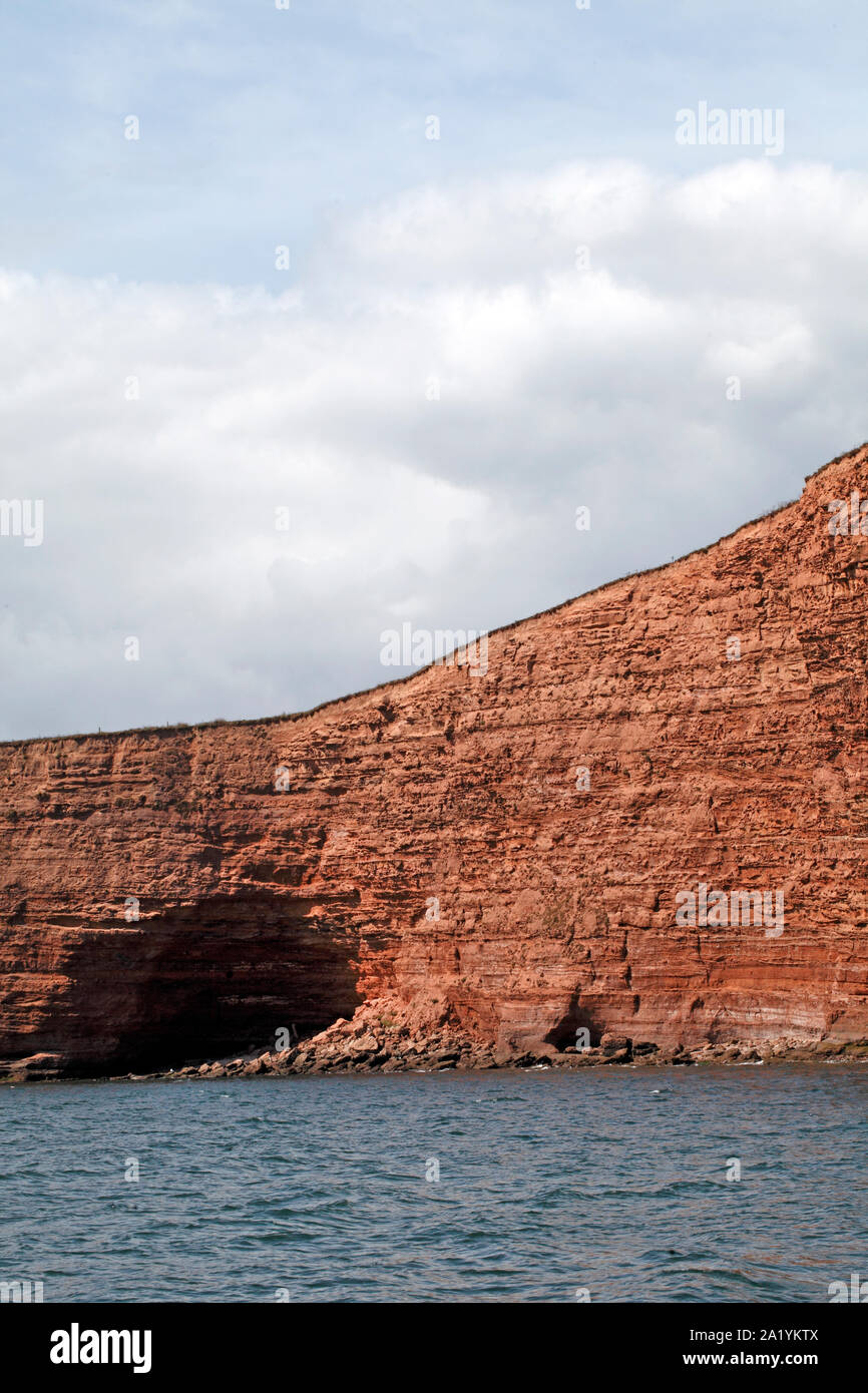 Towering red sandstone cliffs on the East Devon coast. UK. Rock, strata ...