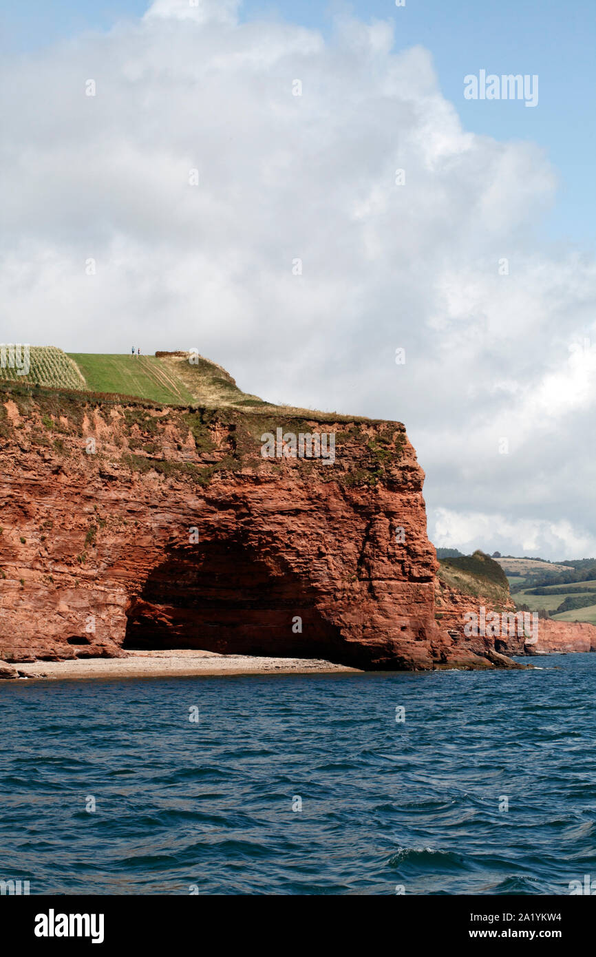 Towering red sandstone cliffs on the East Devon coast. UK. Rock, strata ...