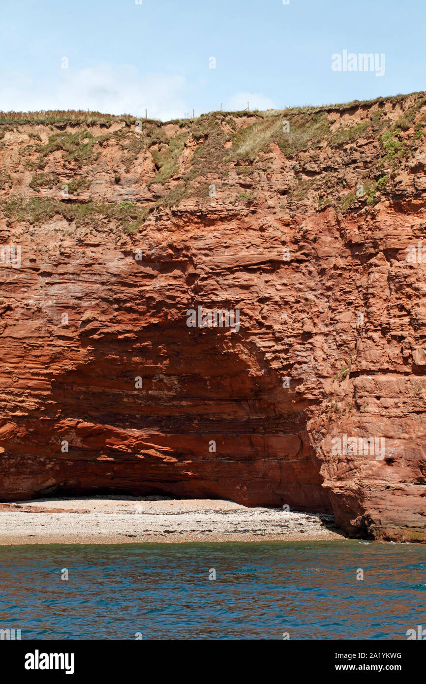 Towering red sandstone cliffs on the East Devon coast. UK. Rock, strata ...
