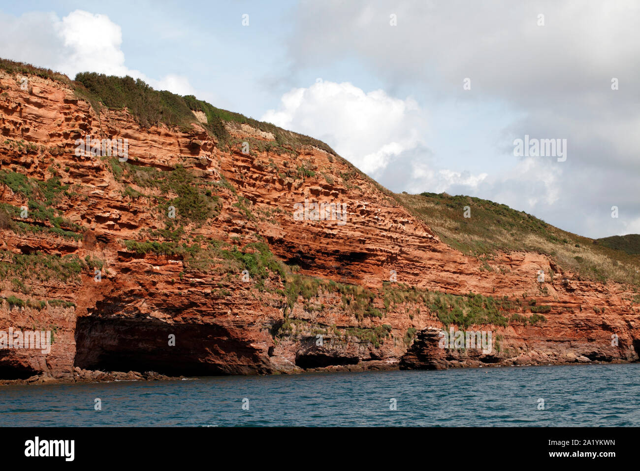 Towering red sandstone cliffs on the East Devon coast. UK. Rock, strata ...