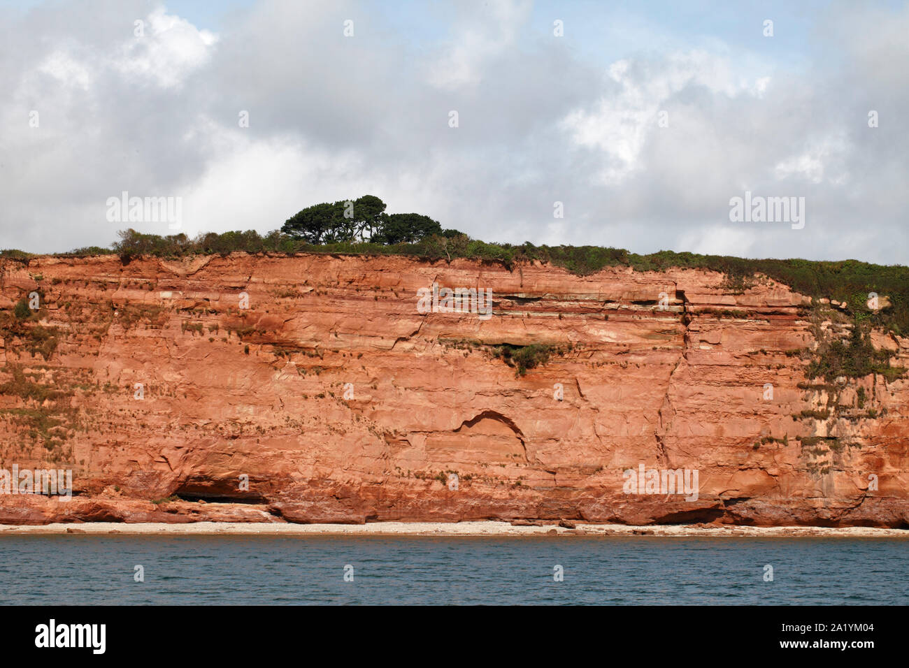 Towering red sandstone cliffs on the East Devon coast. UK. Rock, strata ...
