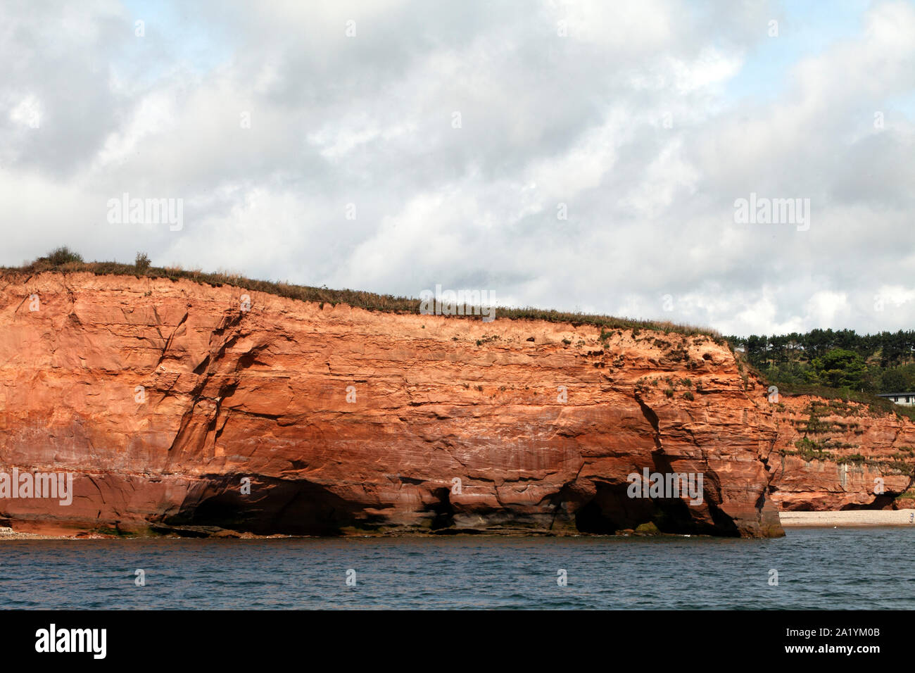 Towering red sandstone cliffs on the East Devon coast. UK. Rock, strata ...