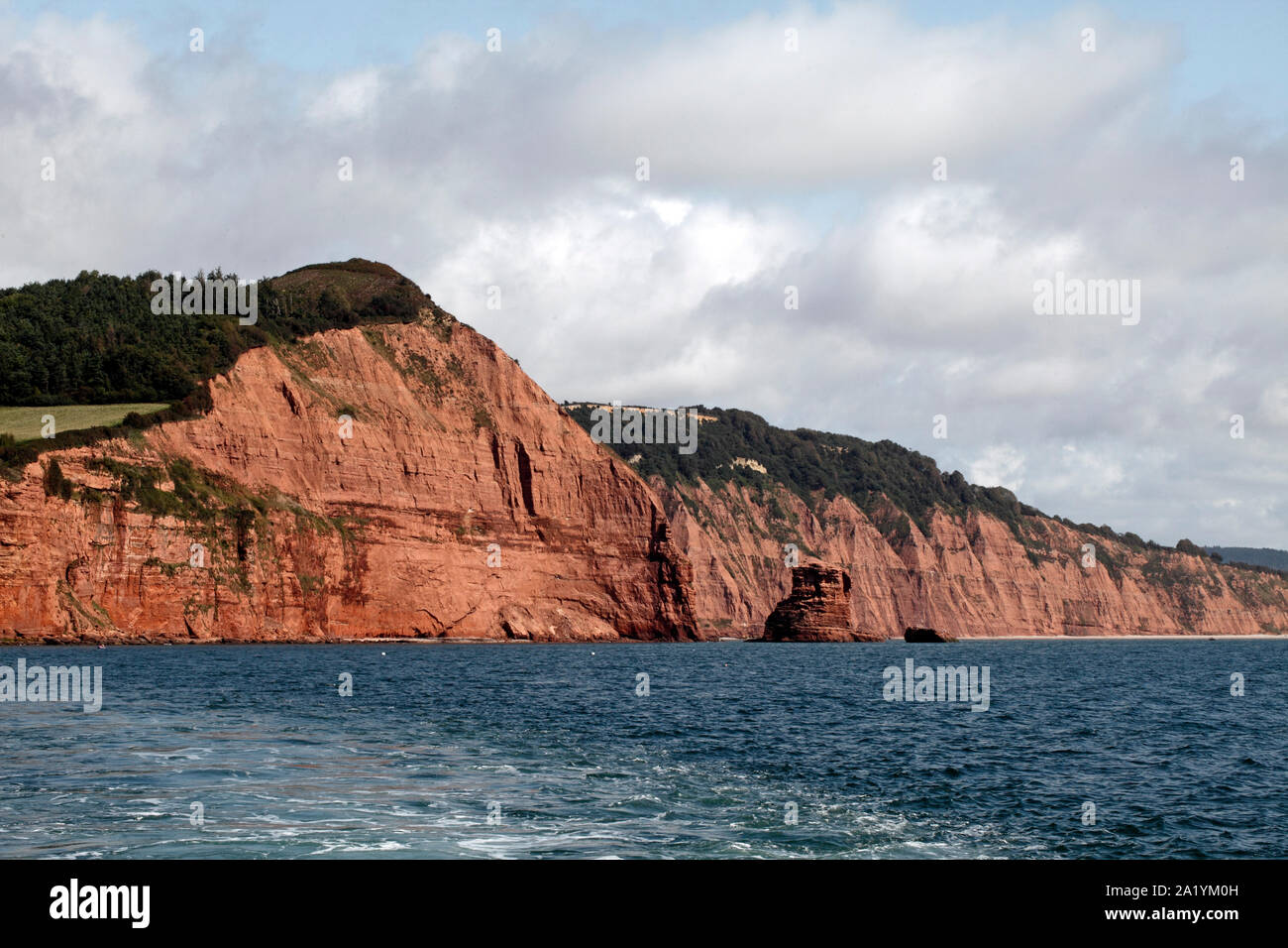 Towering red sandstone cliffs on the East Devon coast. UK. Rock, strata ...